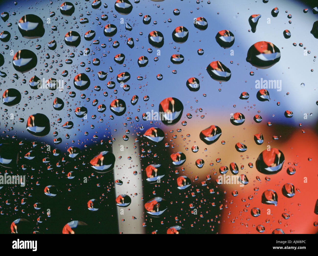 View of rainy day through window person with an umbrella Stock Photo ...