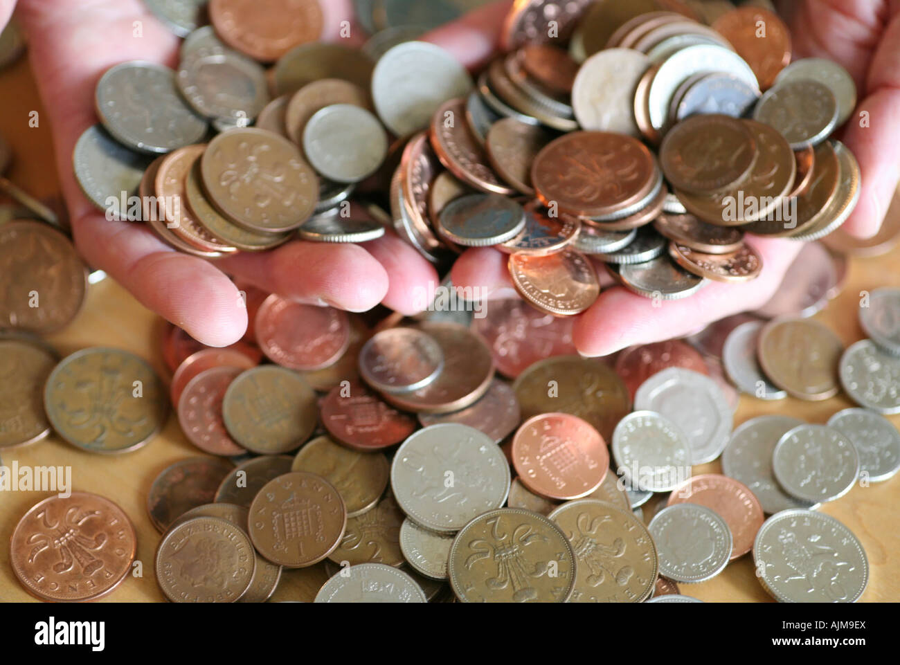 Handful loose change hi-res stock photography and images - Alamy