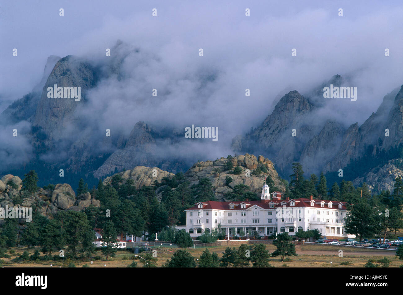 Storm clouds surround mountain side above historic Stanley Hotel Estes ...
