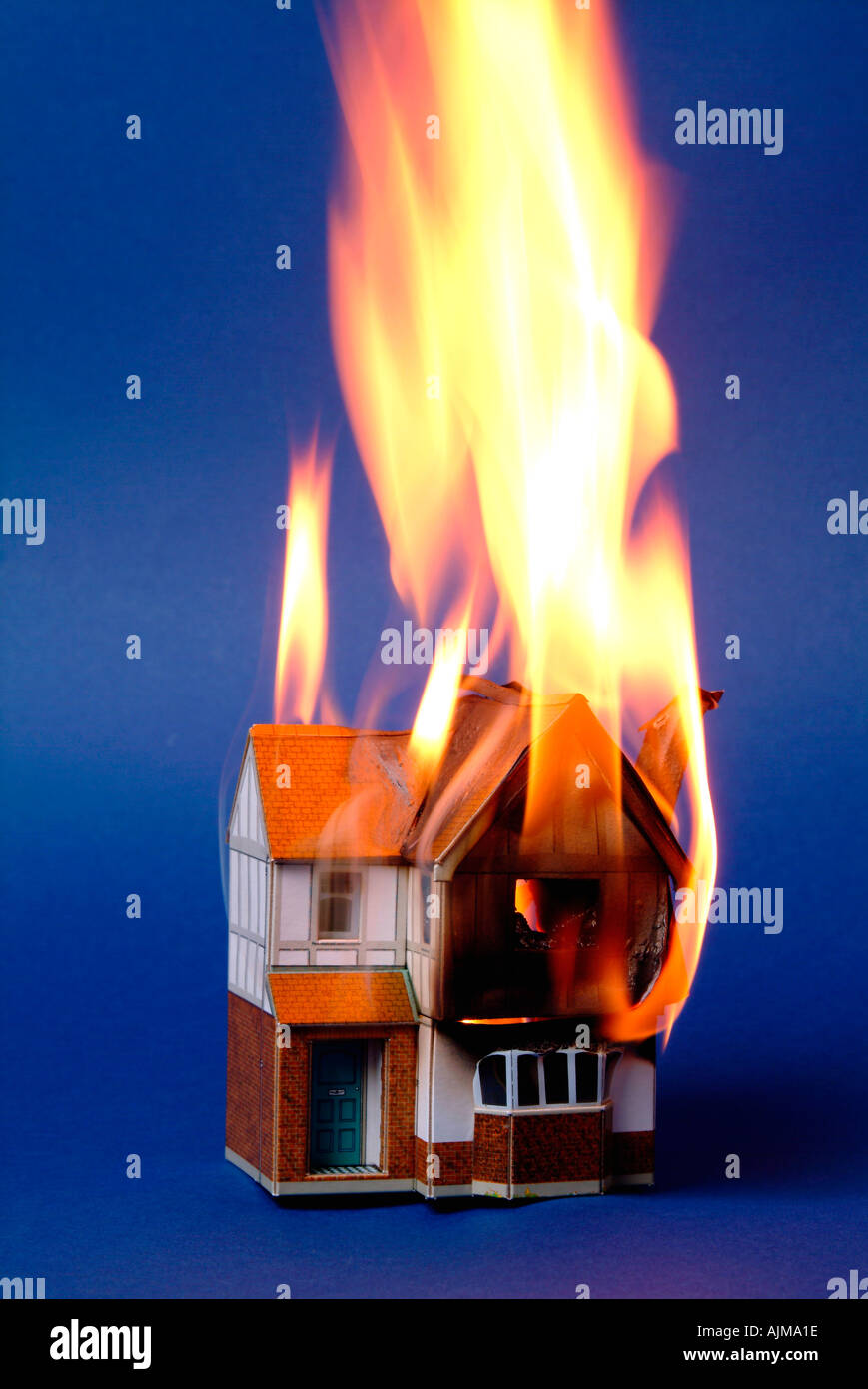Cardboard house on fire Stock Photo - Alamy