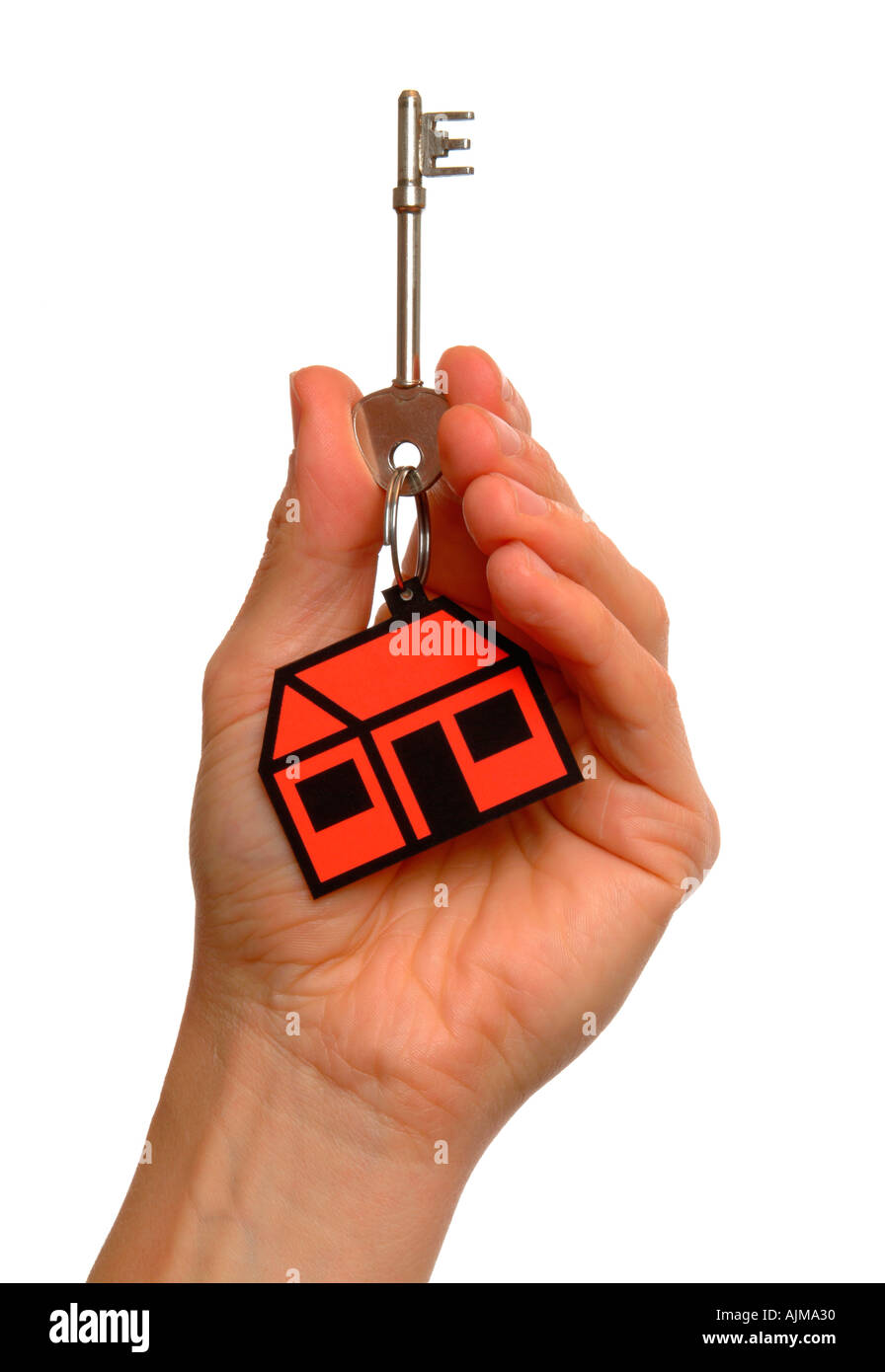 Hand holding house key Stock Photo - Alamy