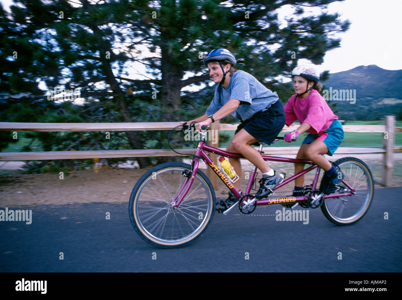 Family riding a tandem bicycle hi-res stock photography and images - Alamy