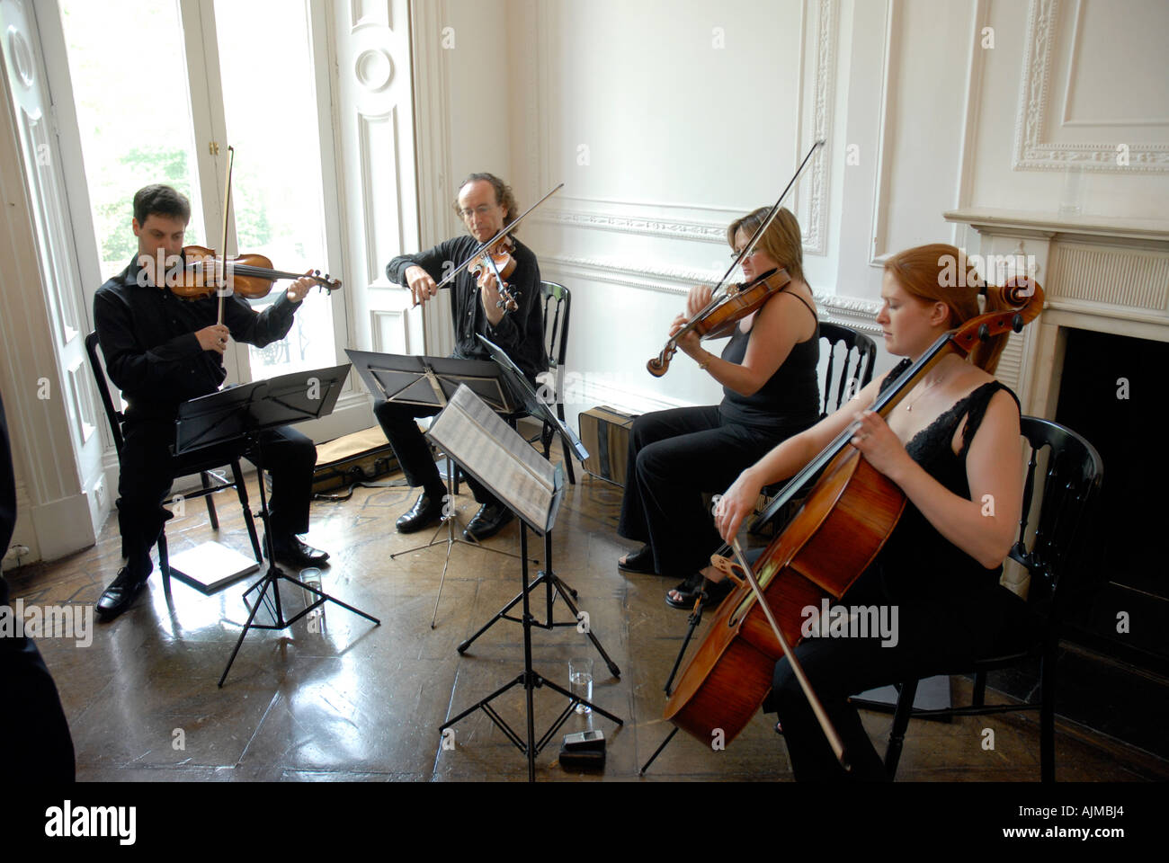 String Quartet Playing In An Elegant House London Stock Photo Alamy String Quartet Playing In An Elegant House London Stock Photo Alamy
