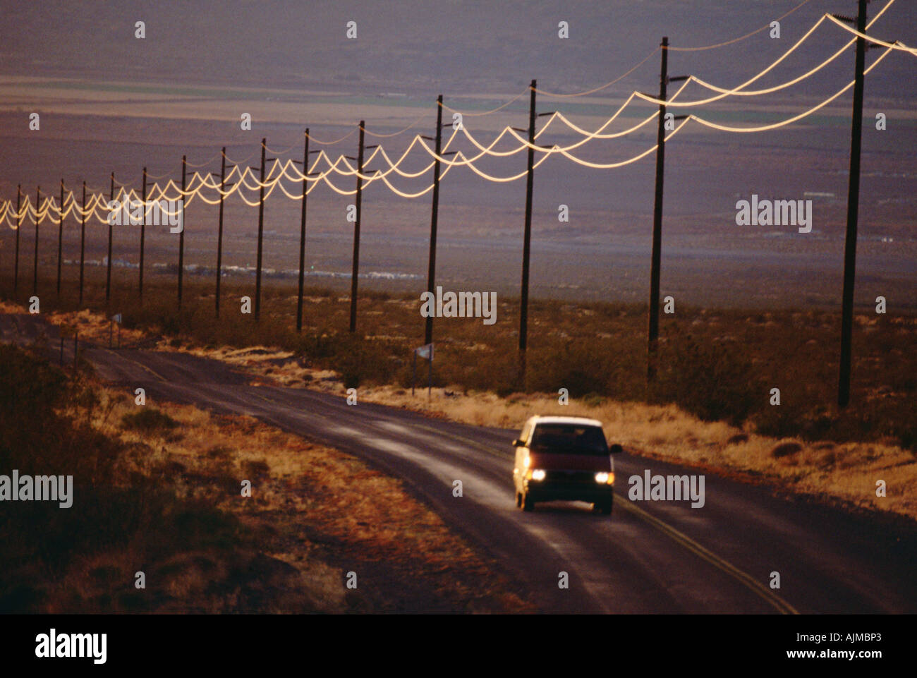 Car driving on isolated road Nevada Stock Photo - Alamy