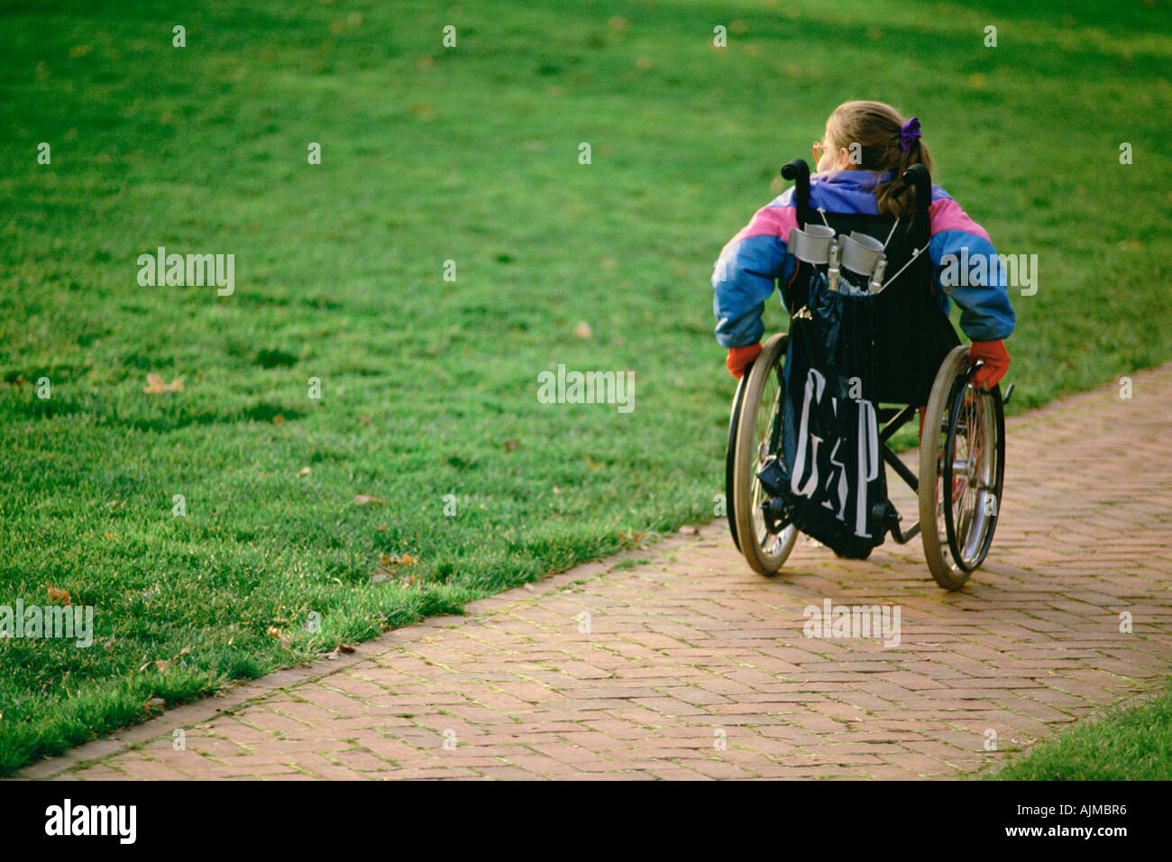 Young girl in a wheelchair Stock Photo - Alamy