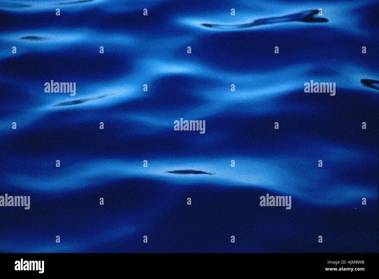 Ripples in blue water Stock Photo - Alamy