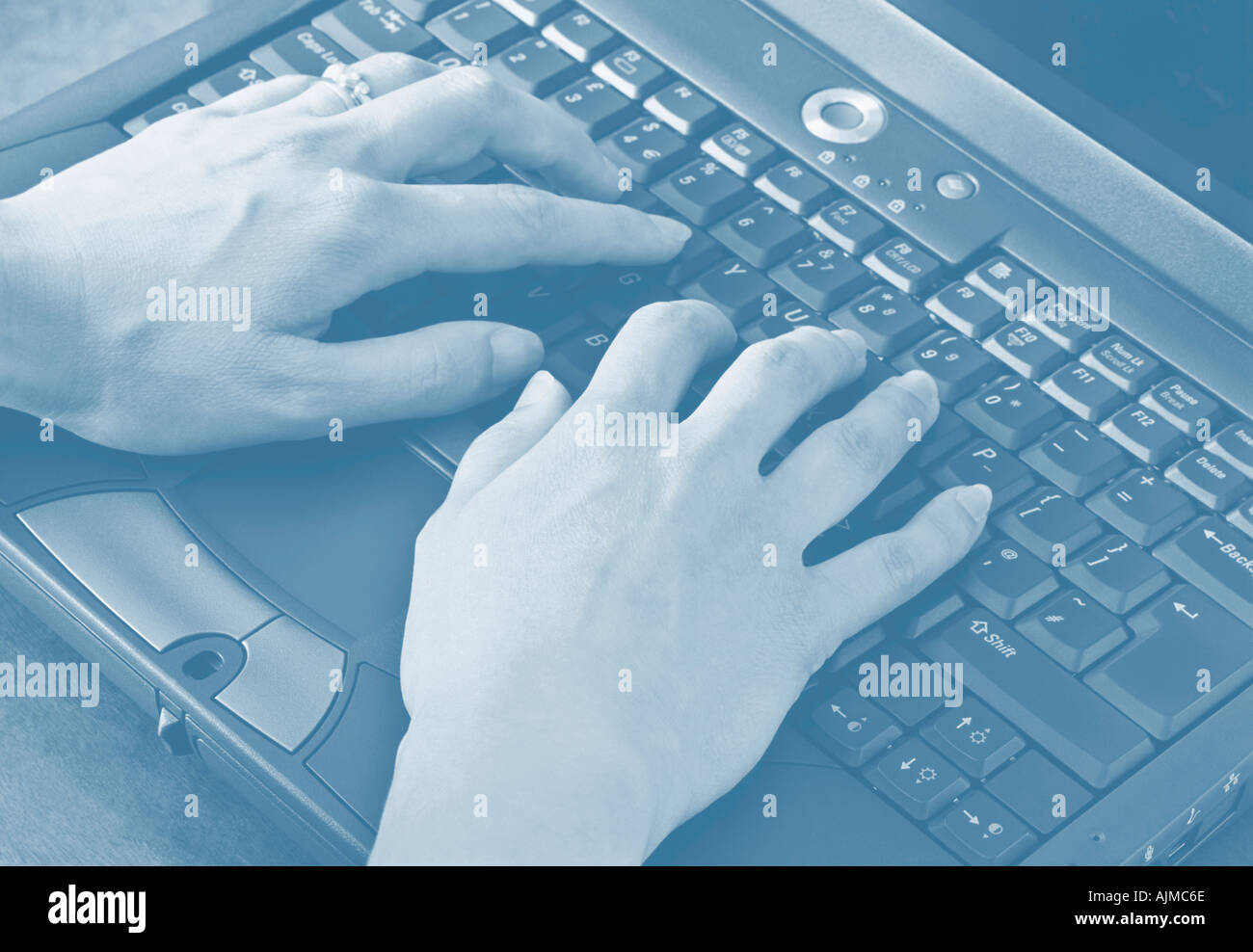 Laptop with Hands on Keyboard Version in Shades of Blue Stock Photo - Alamy