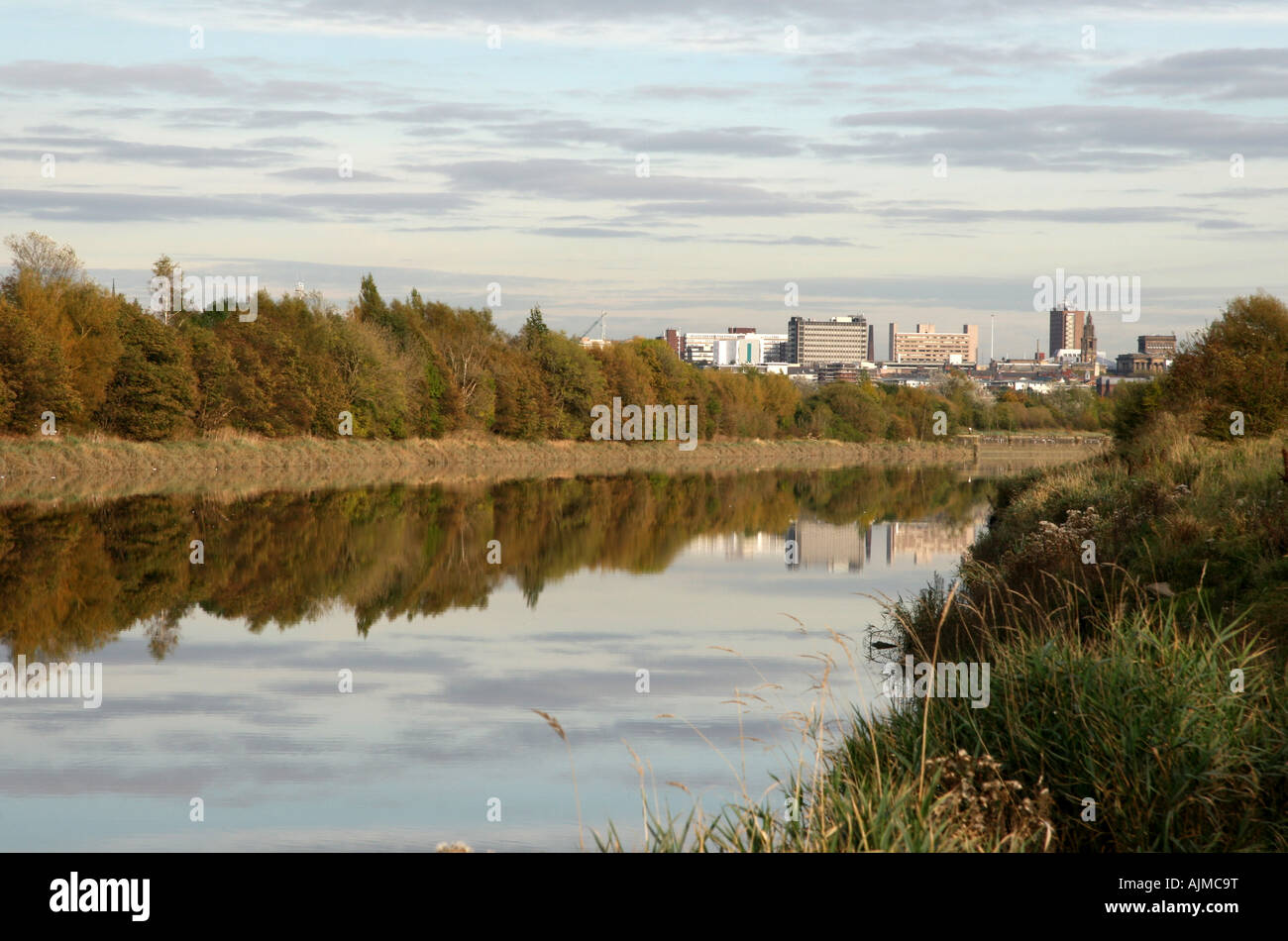The sun shines on Preston city centre, seen from the river Ribble which ...