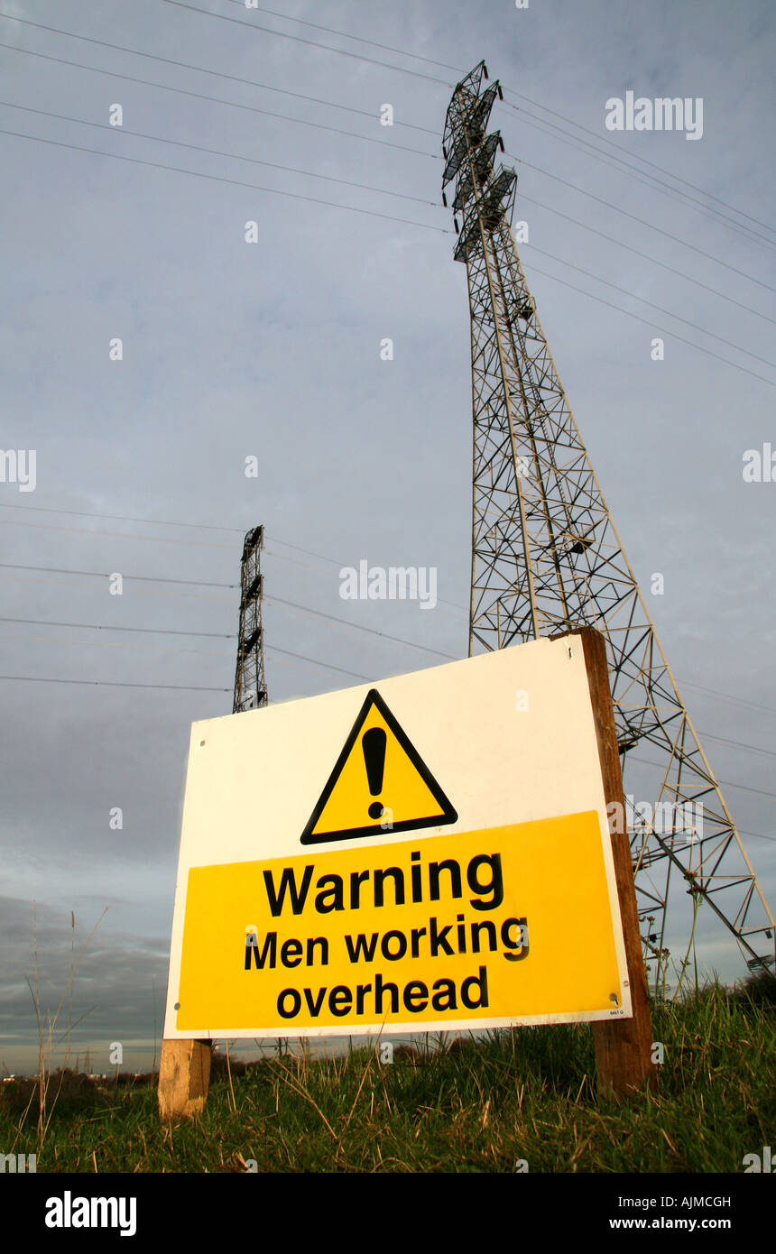 'Warning men working overhead' sign infront of electricity pylons Stock ...