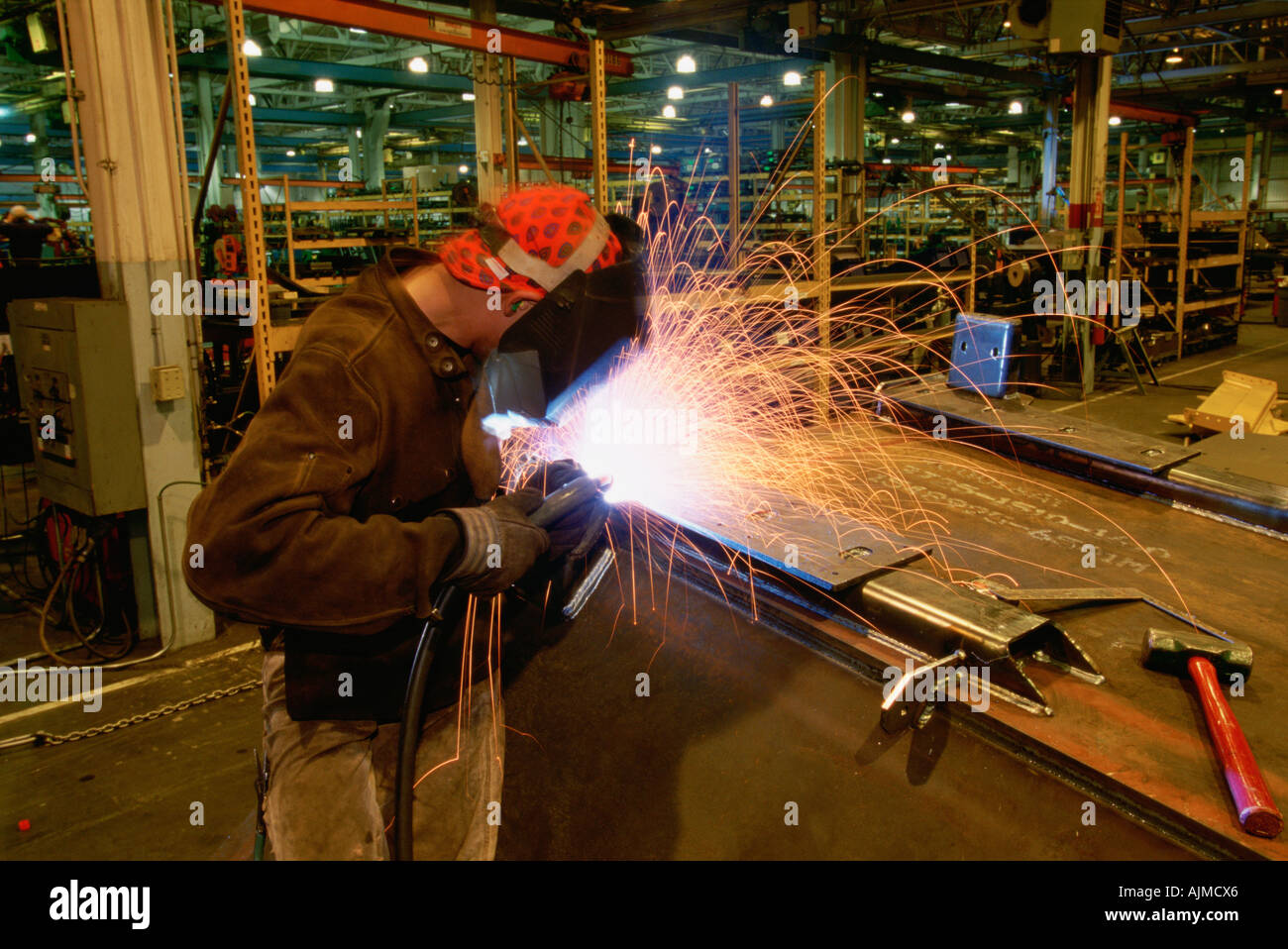 Worker using welding torch Stock Photo - Alamy