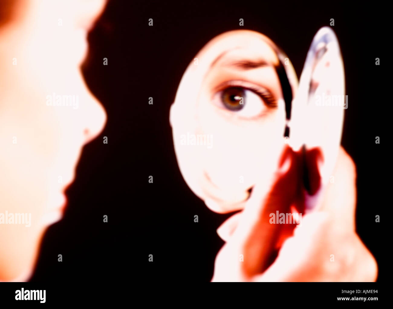 Woman lookin in mirror hi-res stock photography and images - Alamy