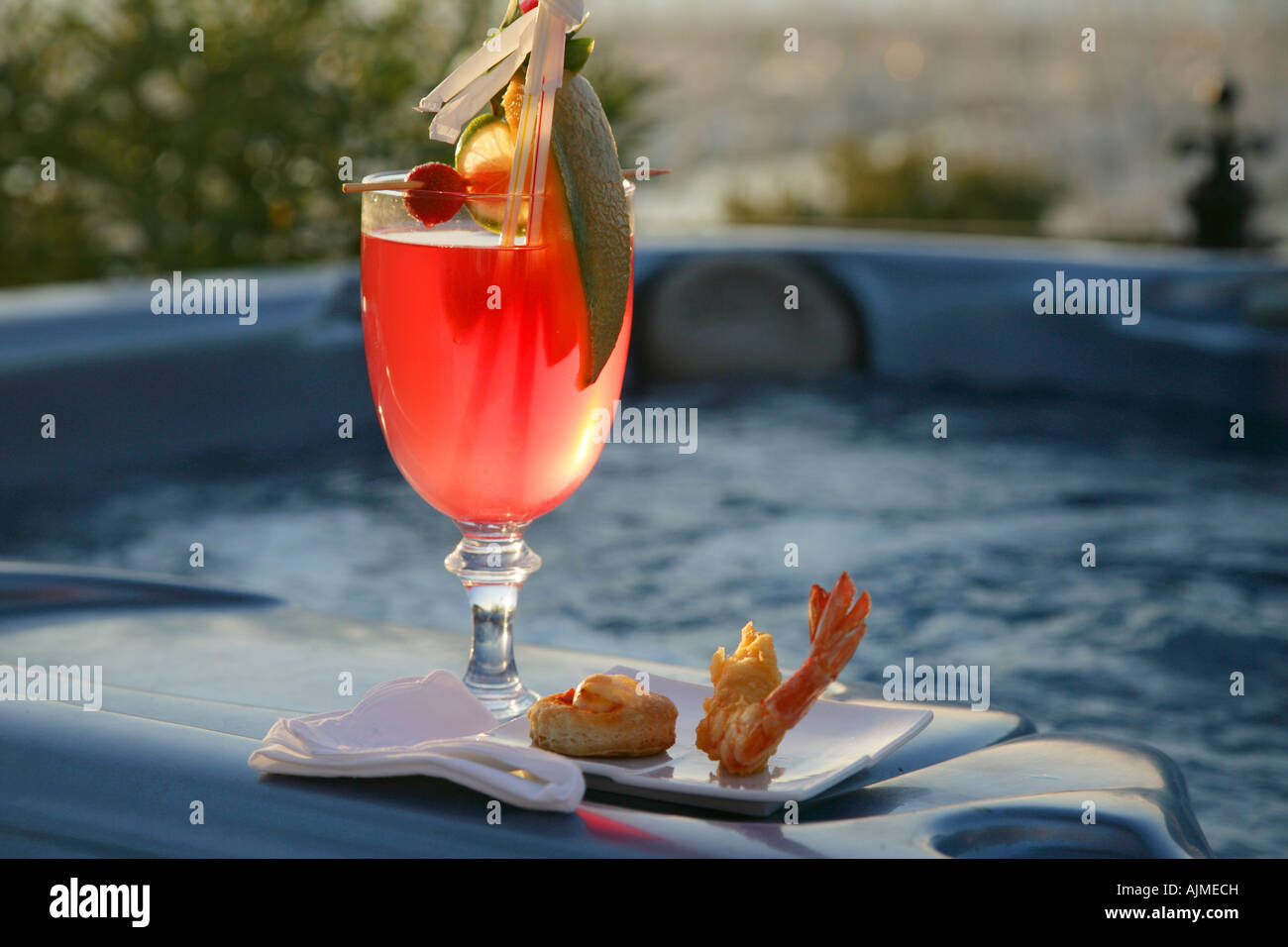 Cocktail served by hot tub, Tuscany, Italy Stock Photo - Alamy