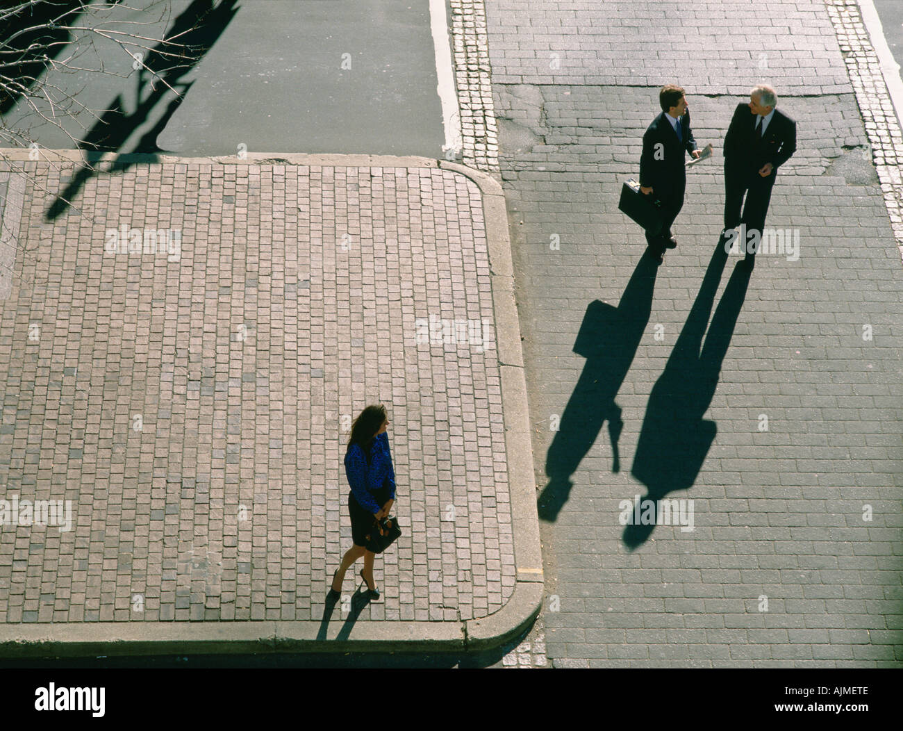 Business people standing and talking on a corner Stock Photo - Alamy