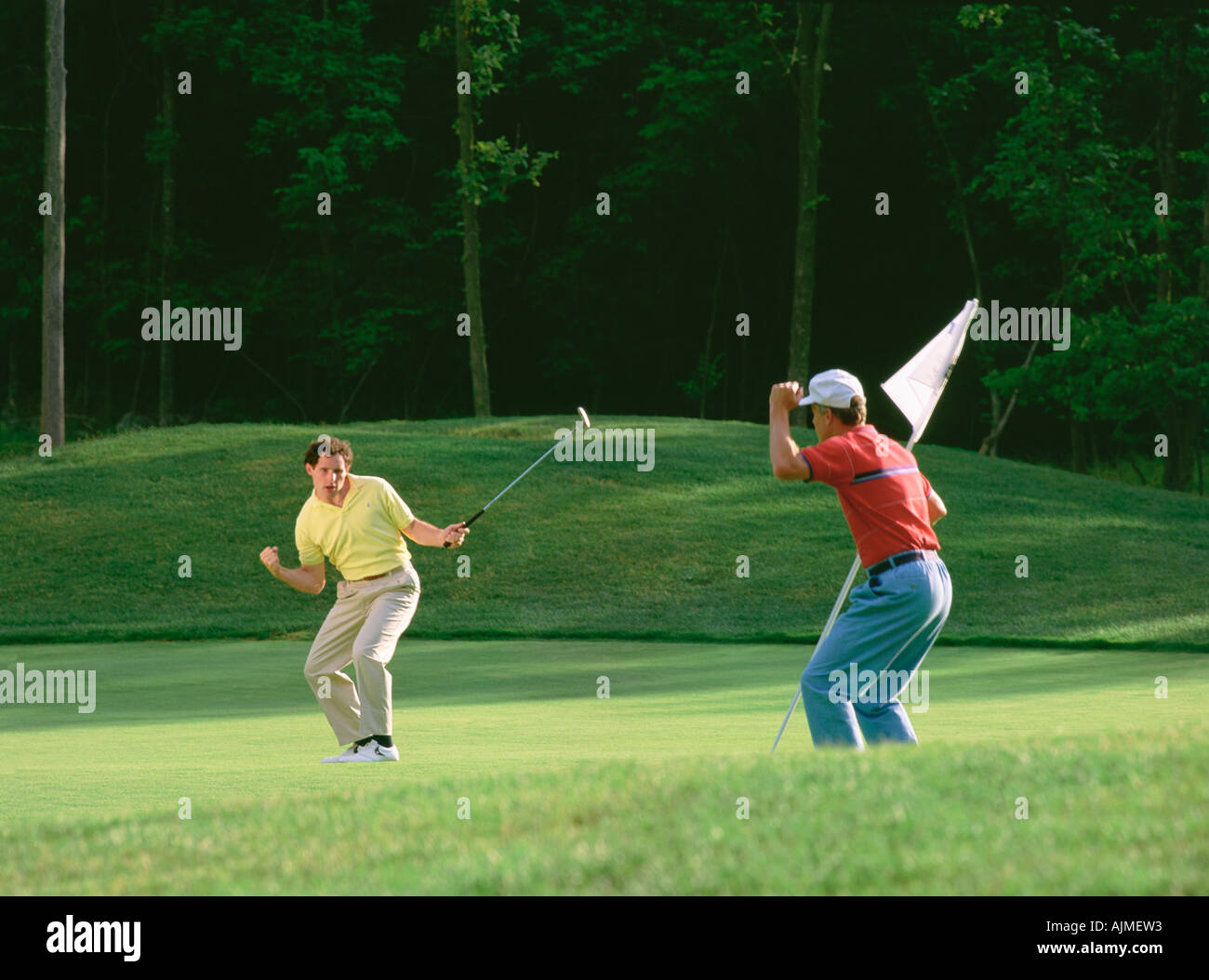 Men playing golf Stock Photo - Alamy