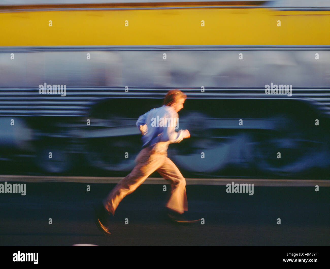 Man running on a track Stock Photo - Alamy