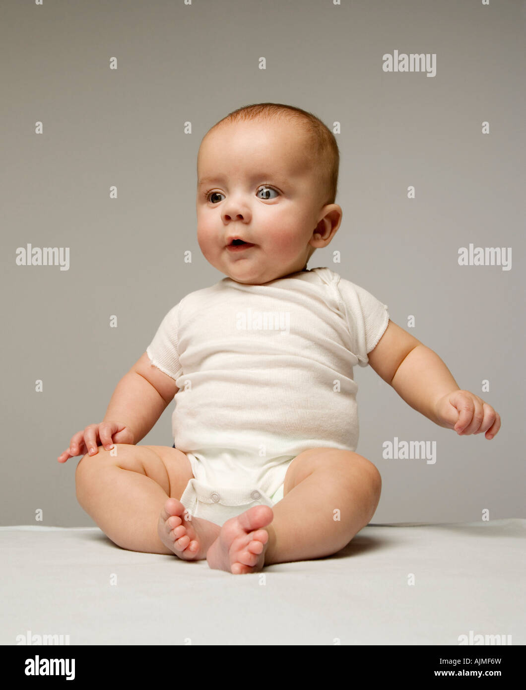 One cute baby learning to sit upright Stock Photo - Alamy