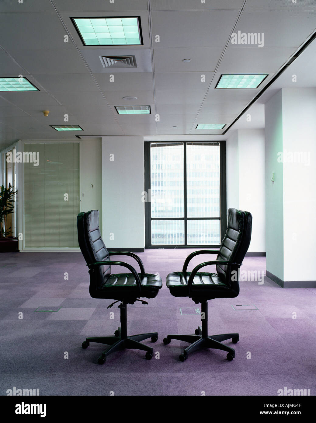 Pair of empty office chairs Stock Photo - Alamy