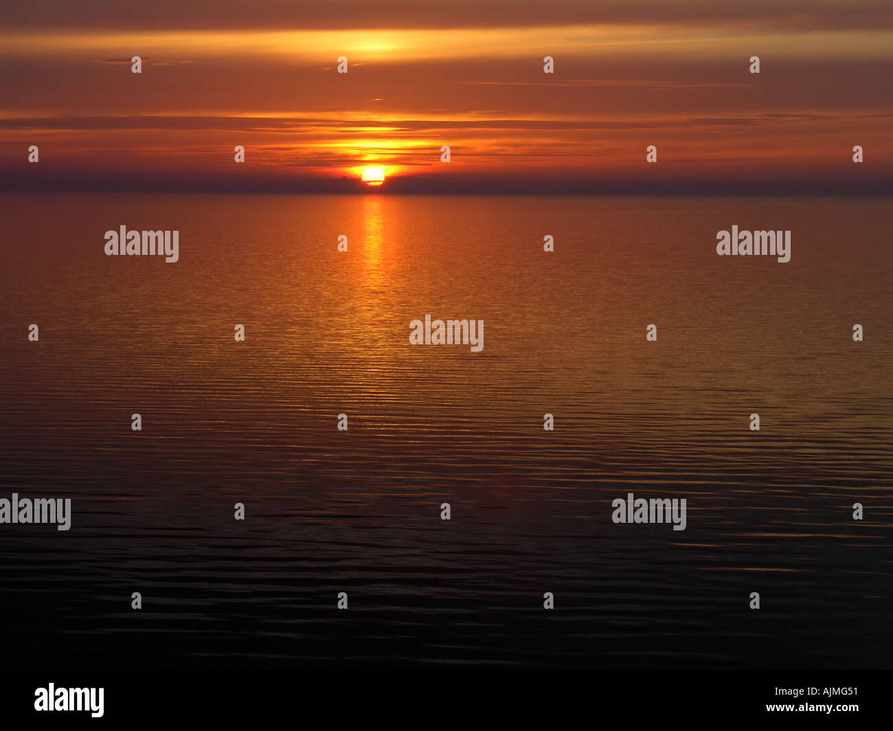 Dramatic colors and sky in sunset over the limfjord Denmark western ...