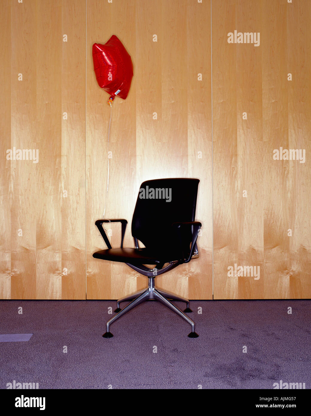 Balloon and an office chair Stock Photo - Alamy
