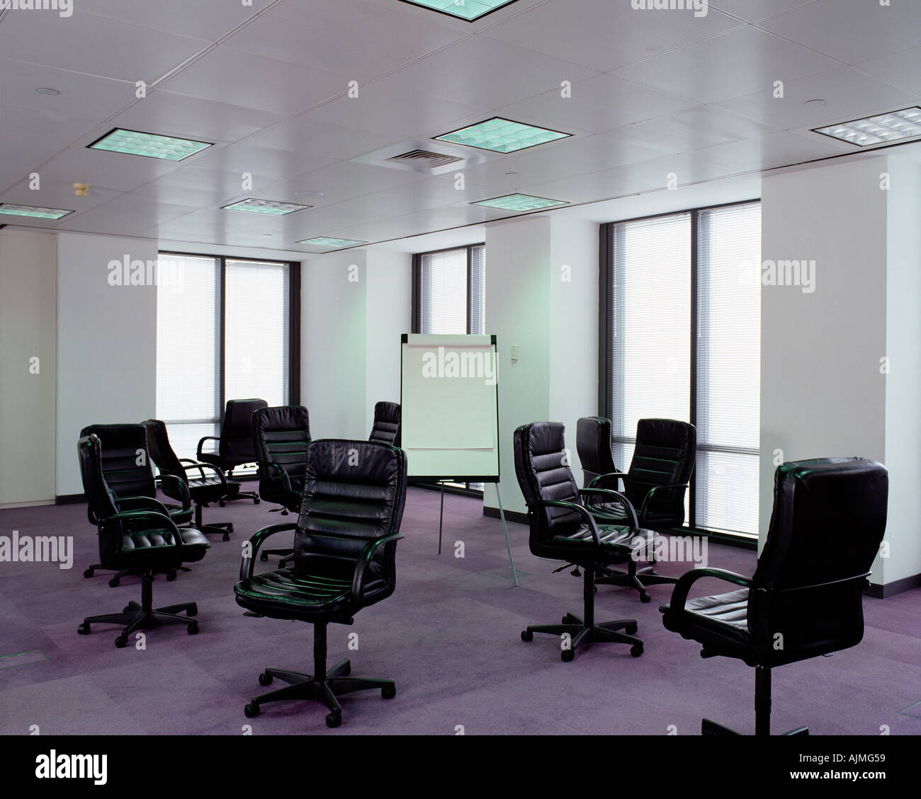 Chairs in empty office Stock Photo - Alamy