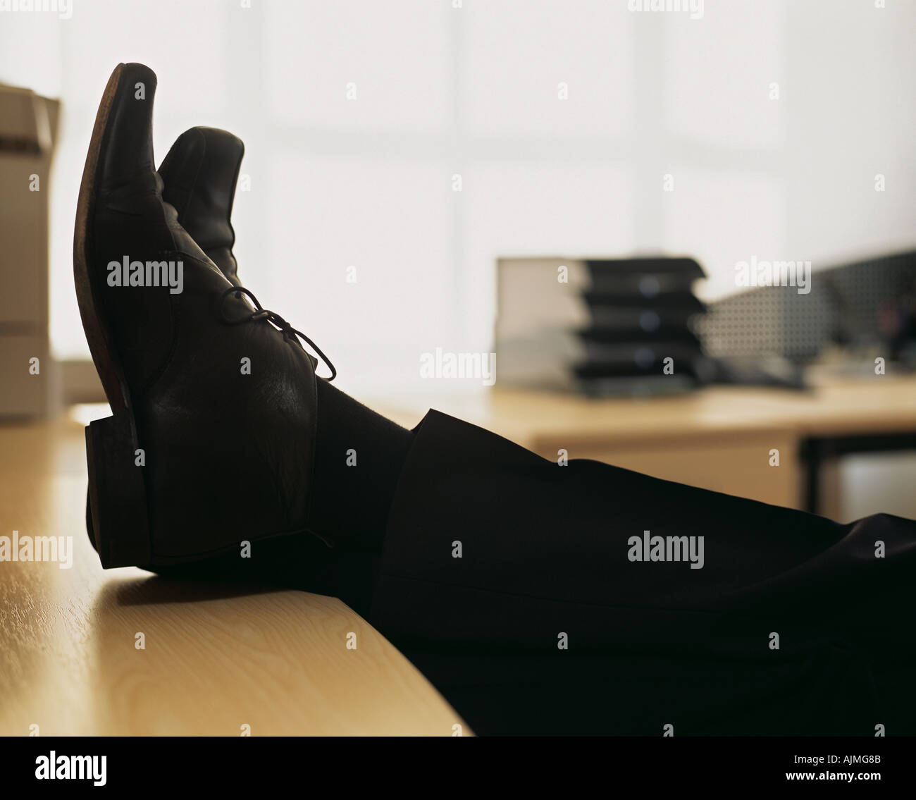 Feet on desk suit hi-res stock photography and images - Alamy