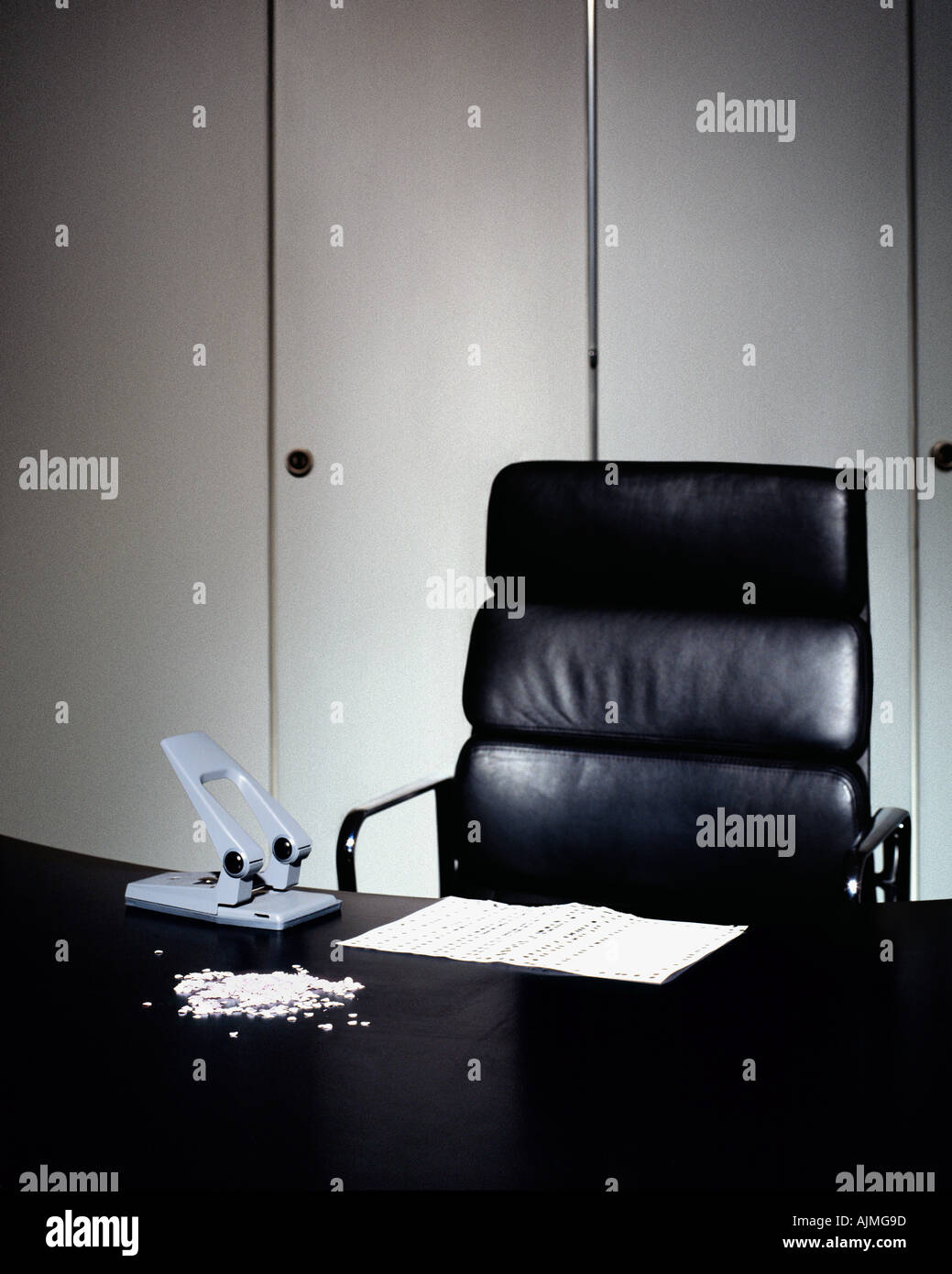 Hole punch on desk Stock Photo - Alamy