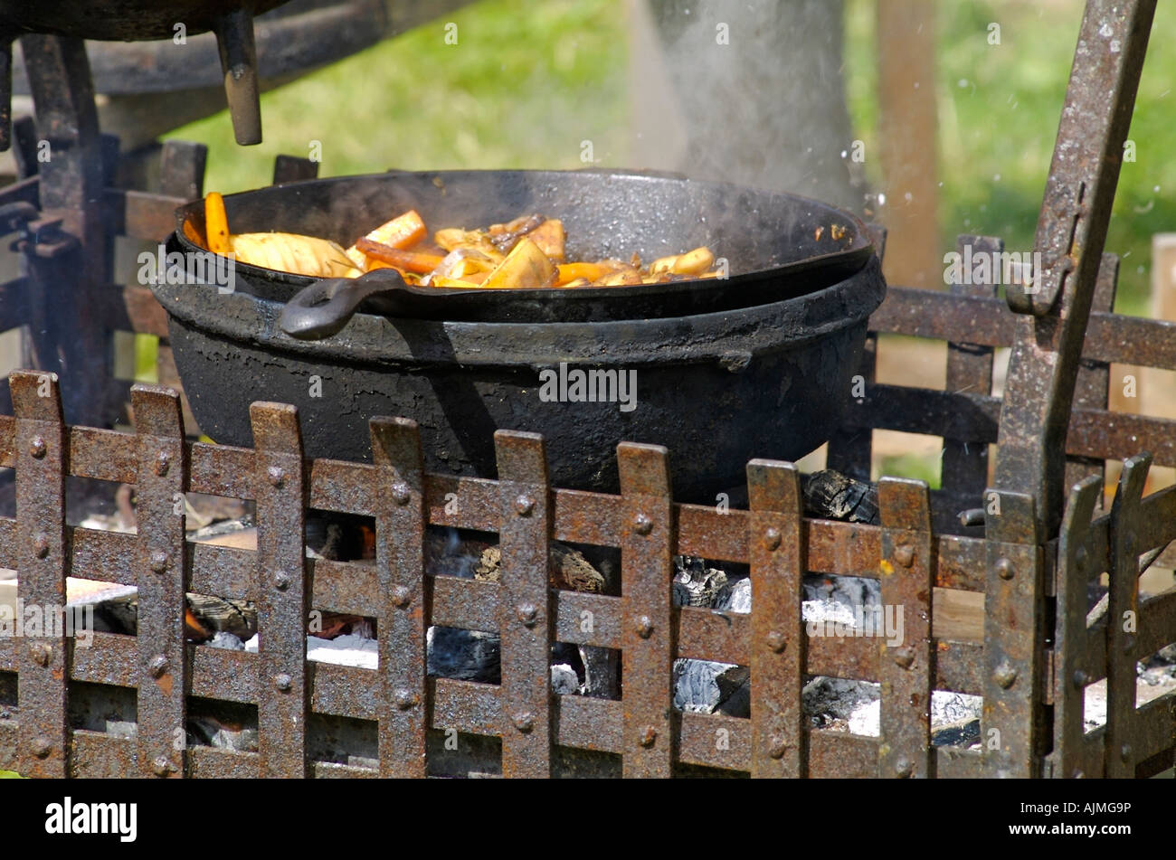 Black Cooking pot shown during medieval feasting Stock Photo - Alamy