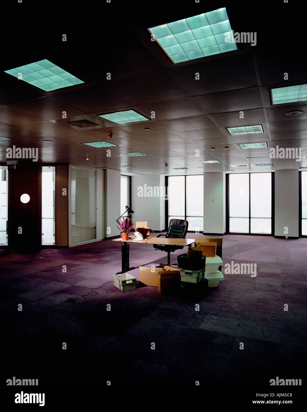 Messy desk in empty office Stock Photo - Alamy