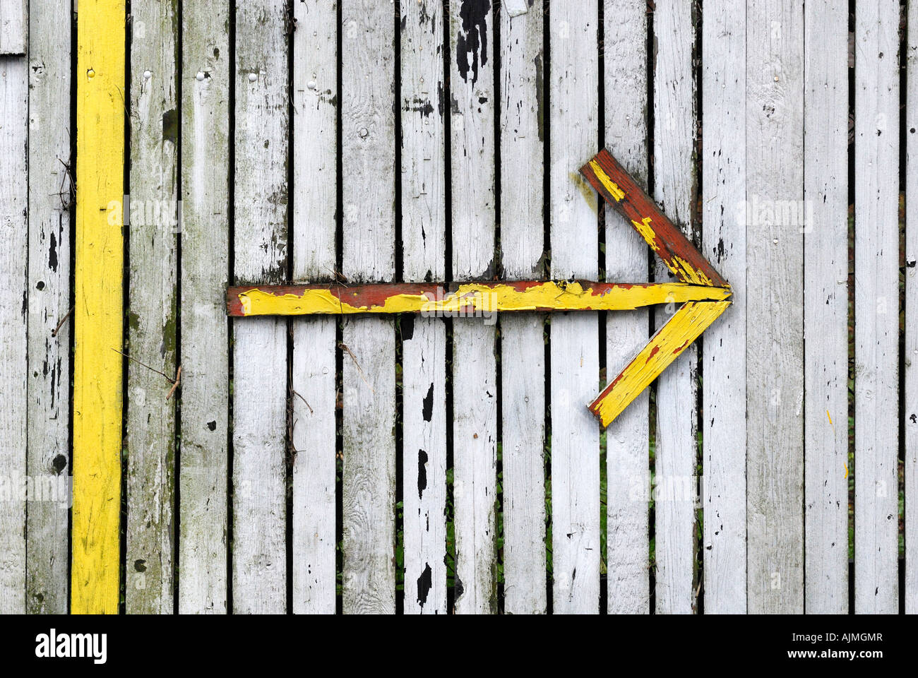 An arrow drawn on a wood wall Stock Photo - Alamy