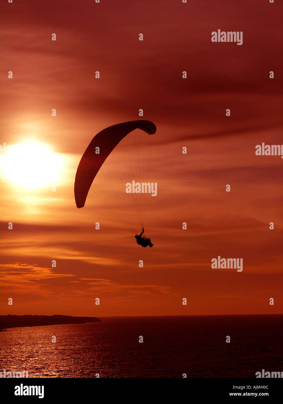 Sunset with paraglider hi-res stock photography and images - Alamy