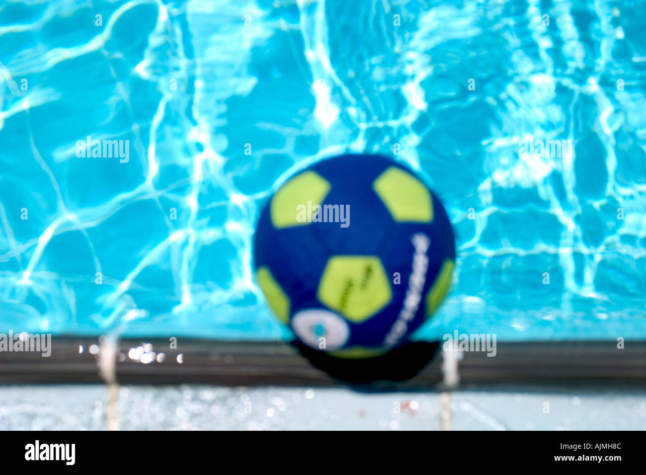 blurred ball on the surface of the blue pool Stock Photo - Alamy