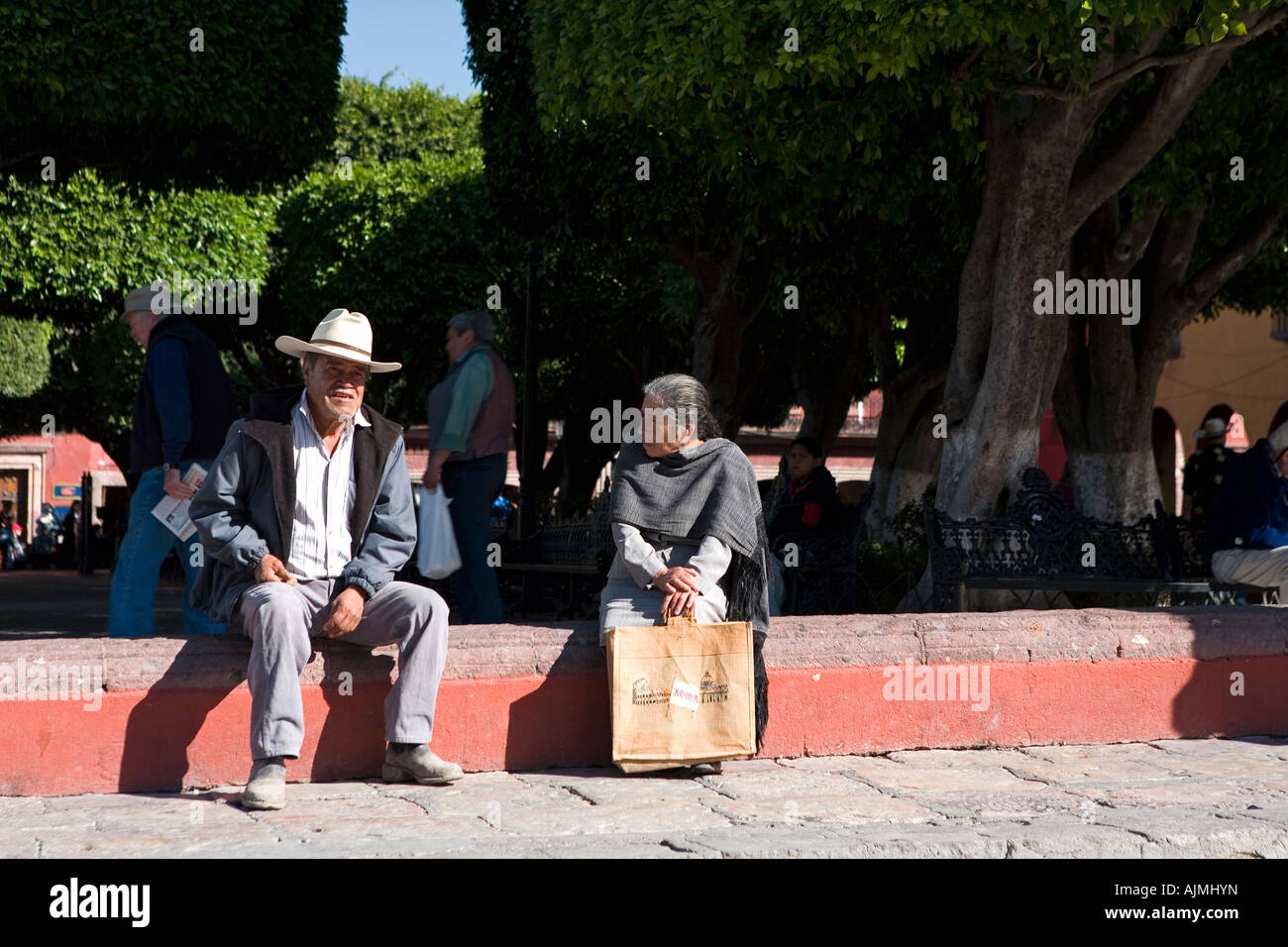 Mexican people sitting around Jardin Principal the main square of San ...