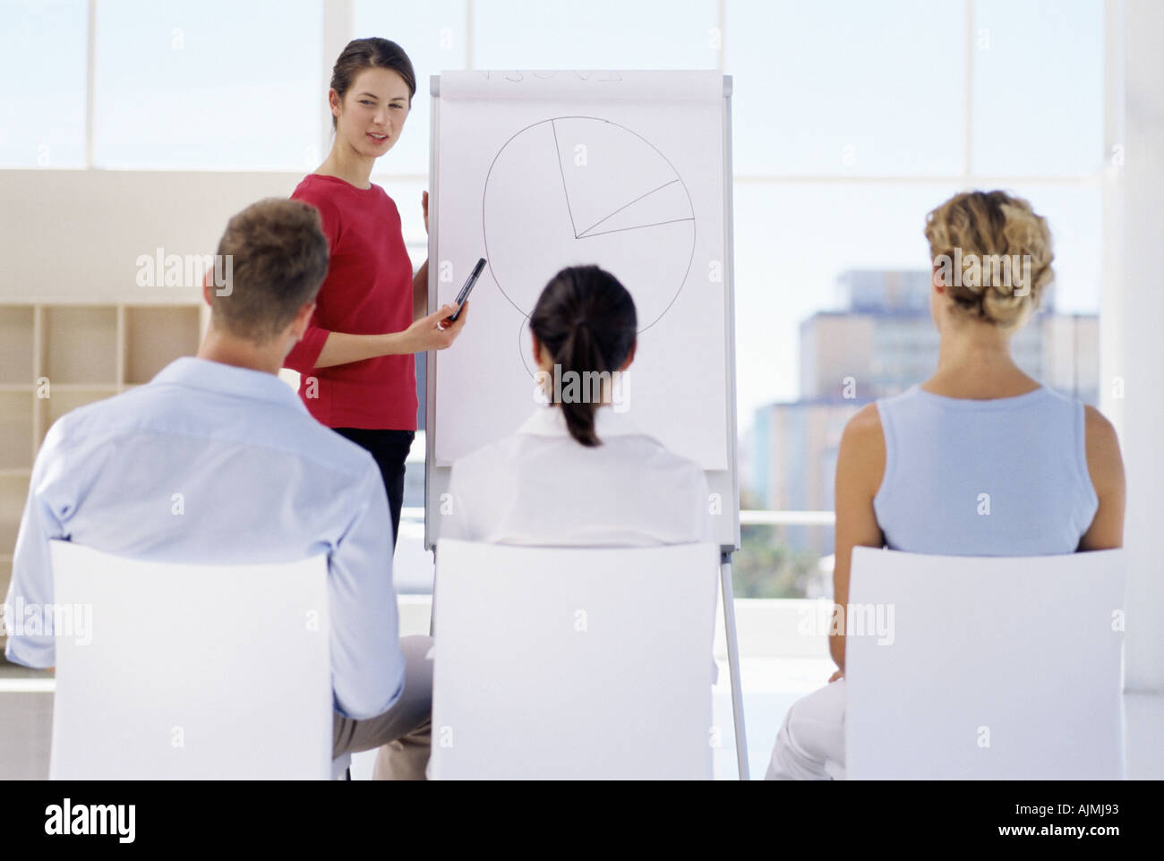Woman giving a presentation Stock Photo - Alamy