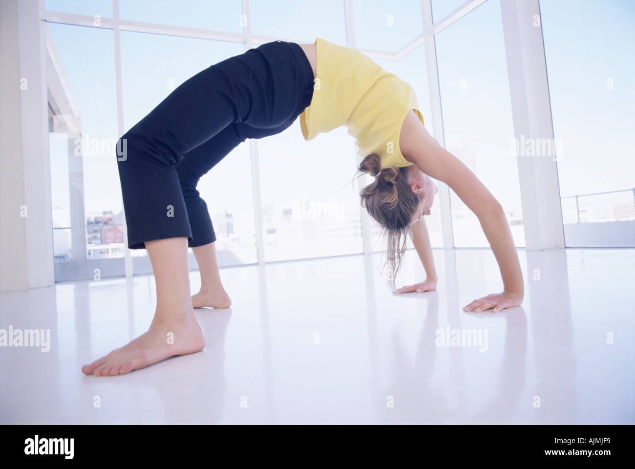 Bend over stretching exercising hi-res stock photography and images - Alamy