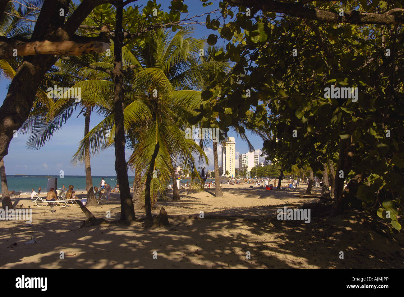 San Juan Puerto Rico Isla Verde beach with sunbathers, blue sky and ...