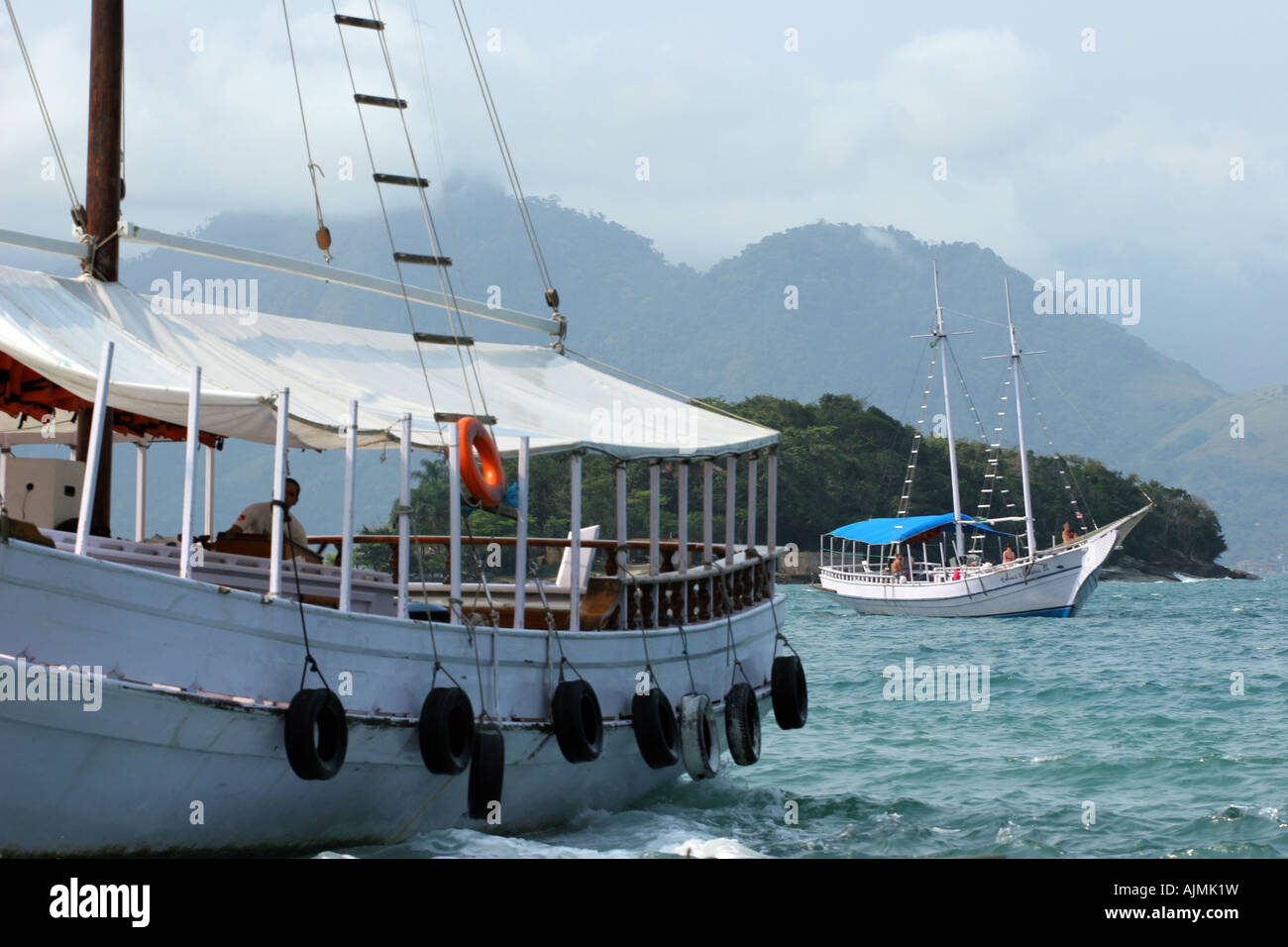 A scooner boat ship sailing during an excursion in Ilha Grande, Rio de ...