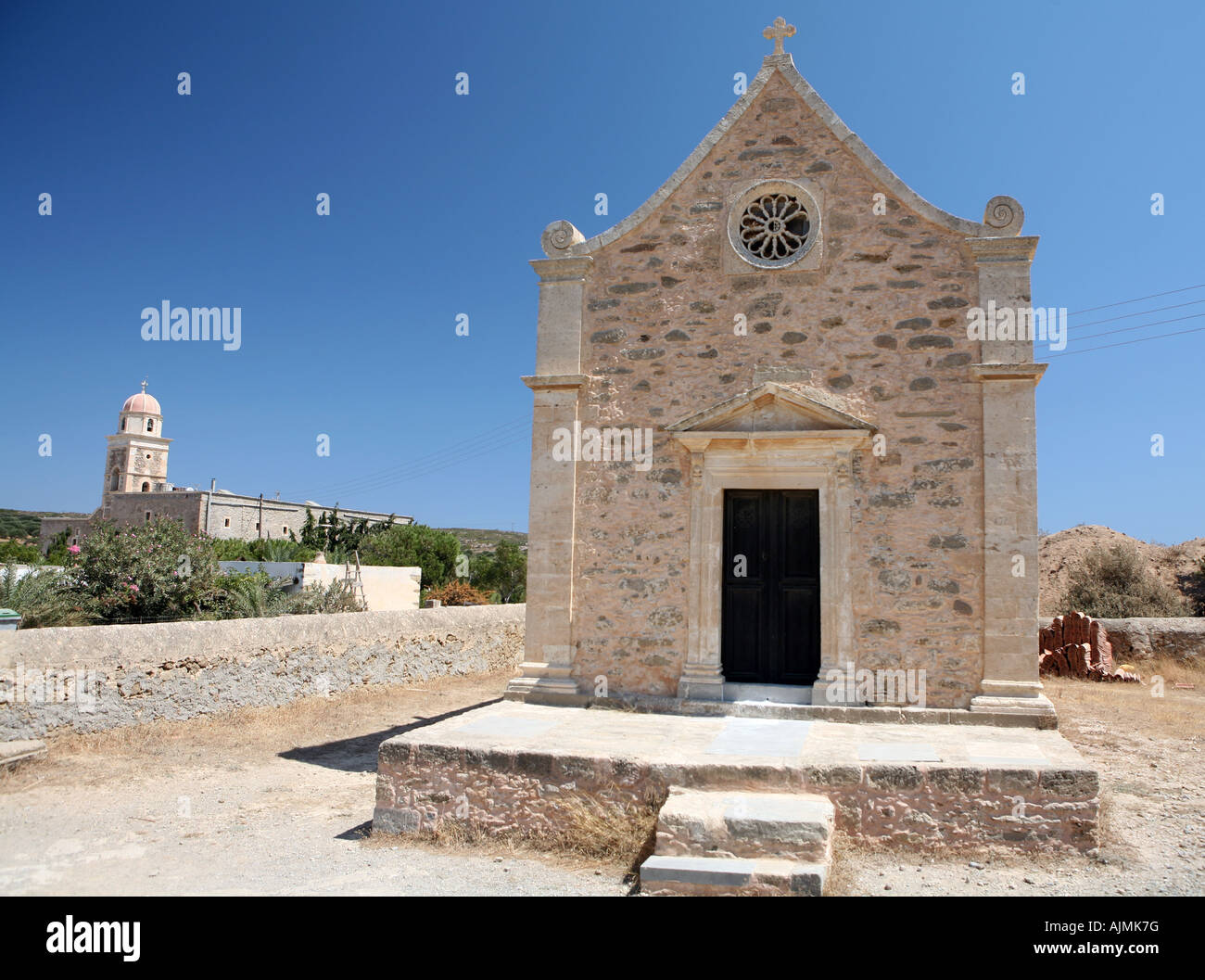 A chapel in the graveyard outside Toplou Monastery (seen left) in ...