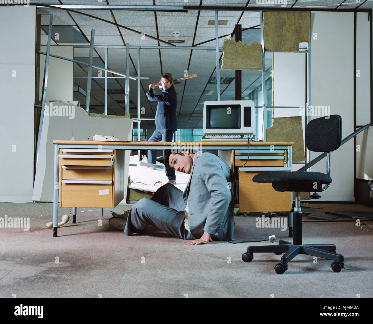 Businessman hiding from colleague's attack Stock Photo - Alamy