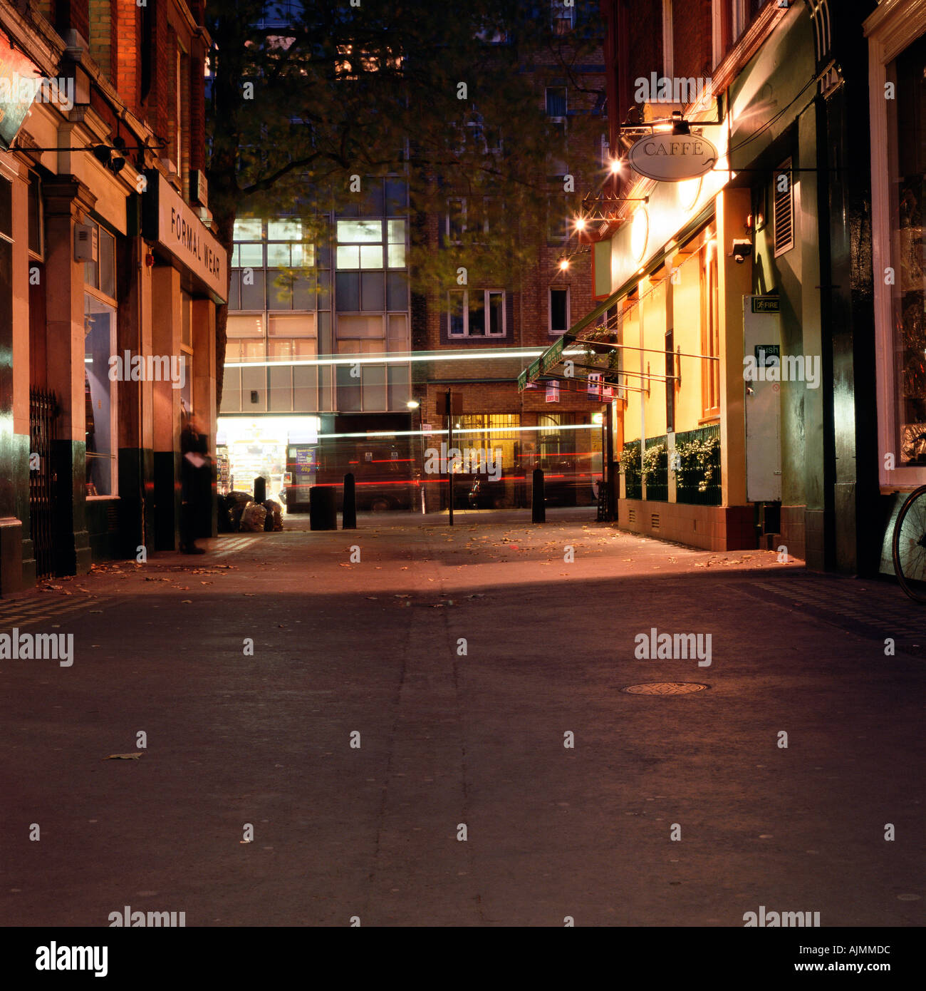 Illuminated street at night Stock Photo - Alamy