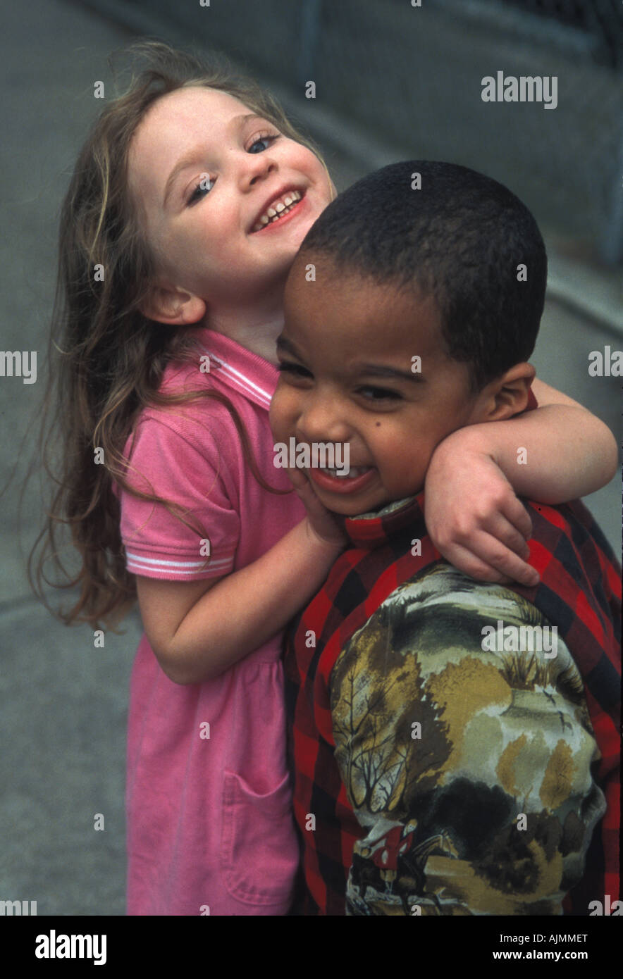 Little girl gives a hug to her neighborhood pal in Brooklyn, New York ...
