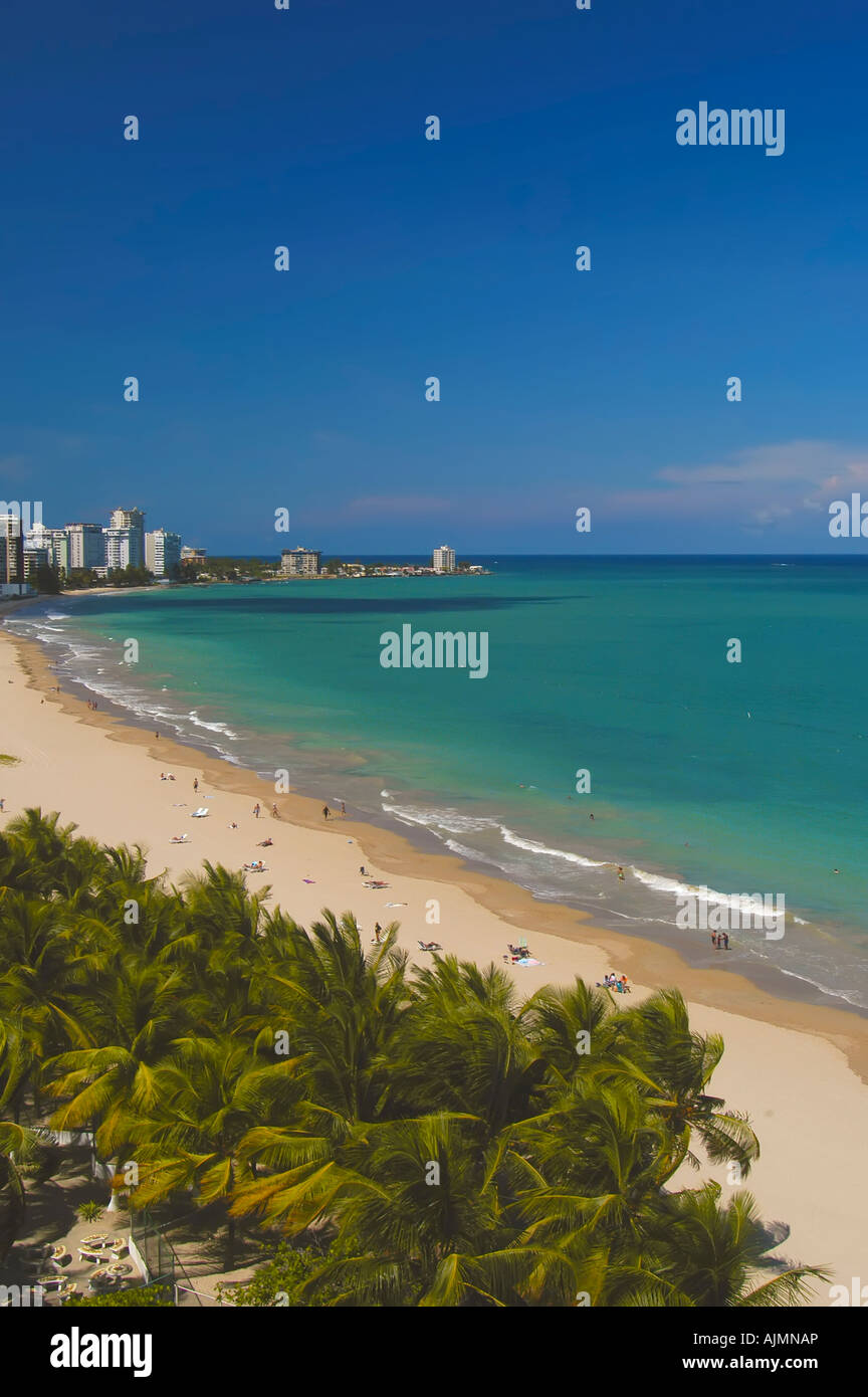 San Juan Puerto Rico Isla Verde beach with sunbathers, blue sky and ...