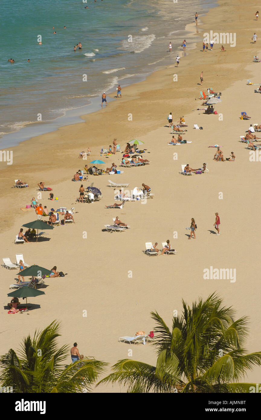San Juan Puerto Rico Isla Verde beach with sunbathers, blue sky and ...