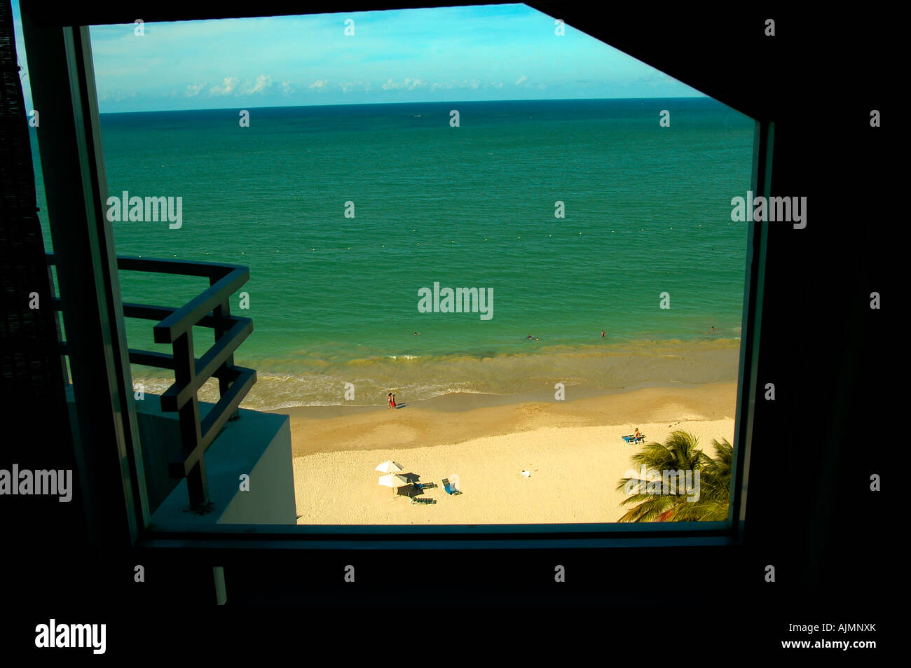 San Juan Puerto Rico Isla Verde beach with sunbathers, blue sky viewed ...