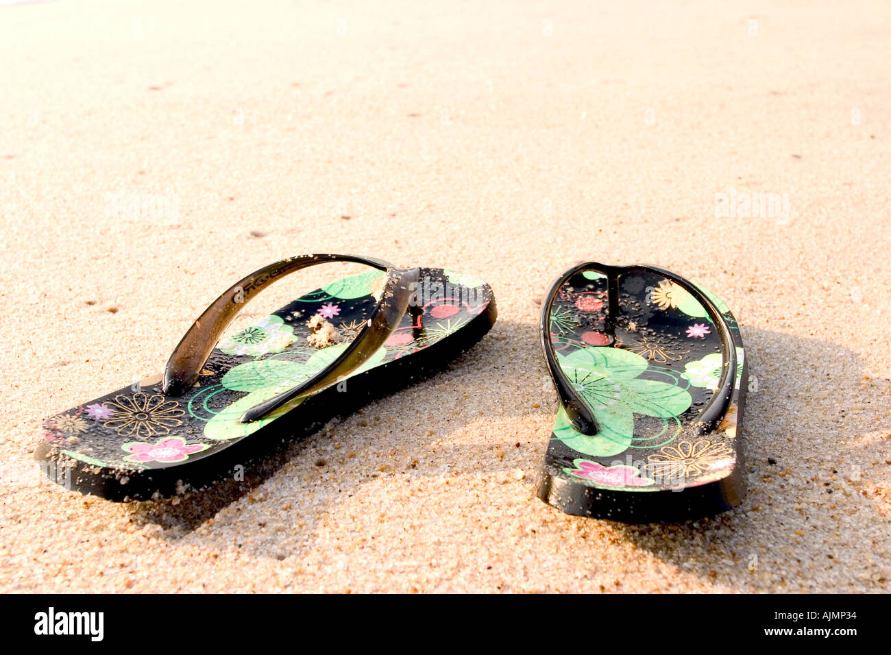 Abandoned flip flop on the beach hi-res stock photography and images ...
