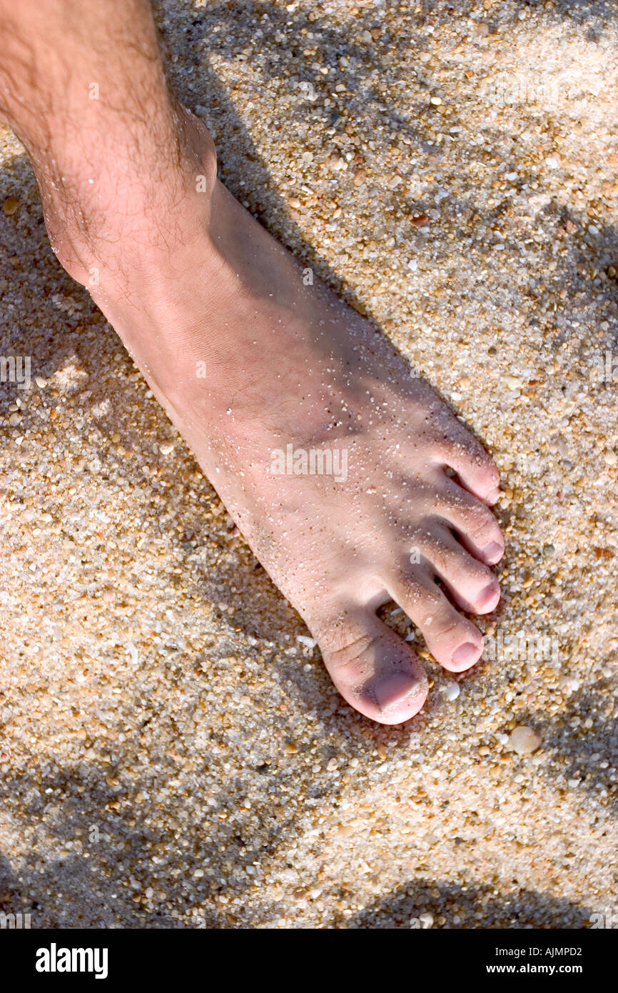 foot on sand Stock Photo - Alamy