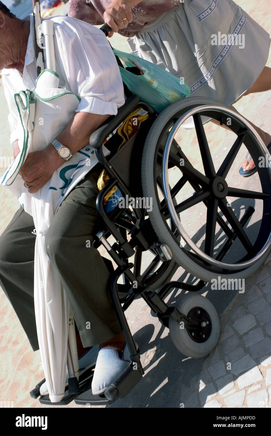 old senior invalid man in wheelchair near the beach Stock Photo - Alamy