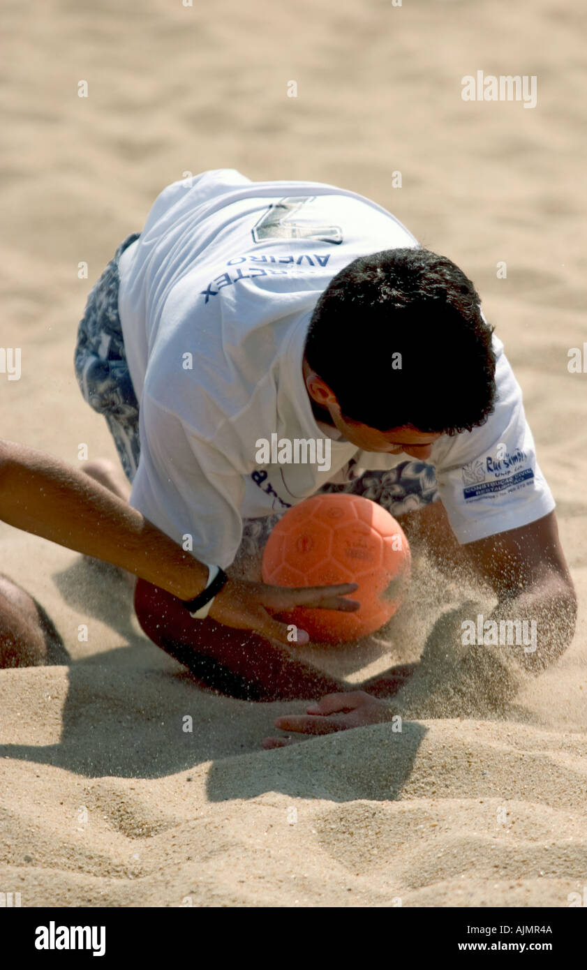 sport handball game action on beach Stock Photo - Alamy