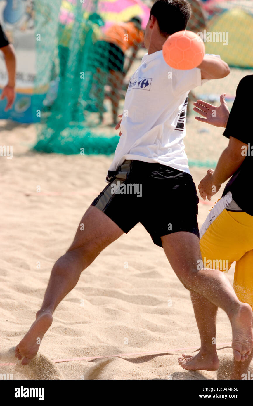 sport handball game action on beach Stock Photo - Alamy