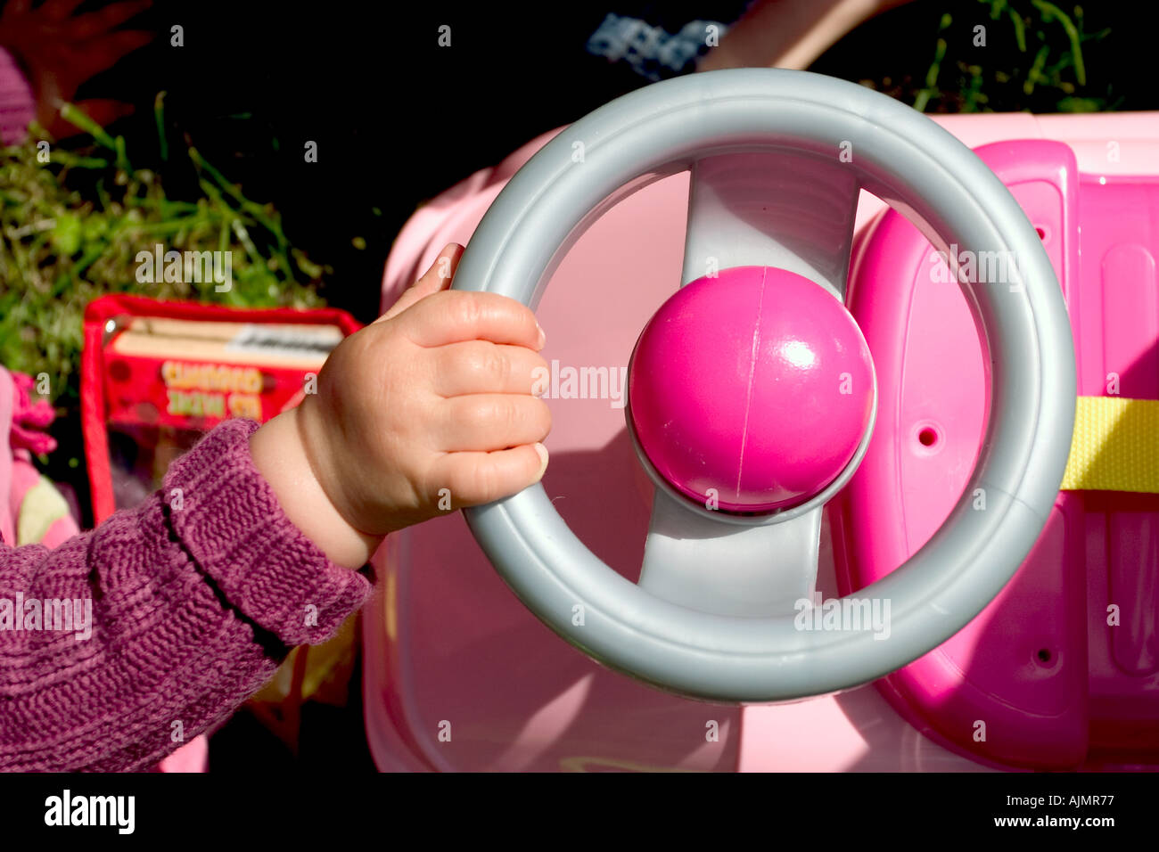 hand and fingers of a child on baby car game Stock Photo - Alamy