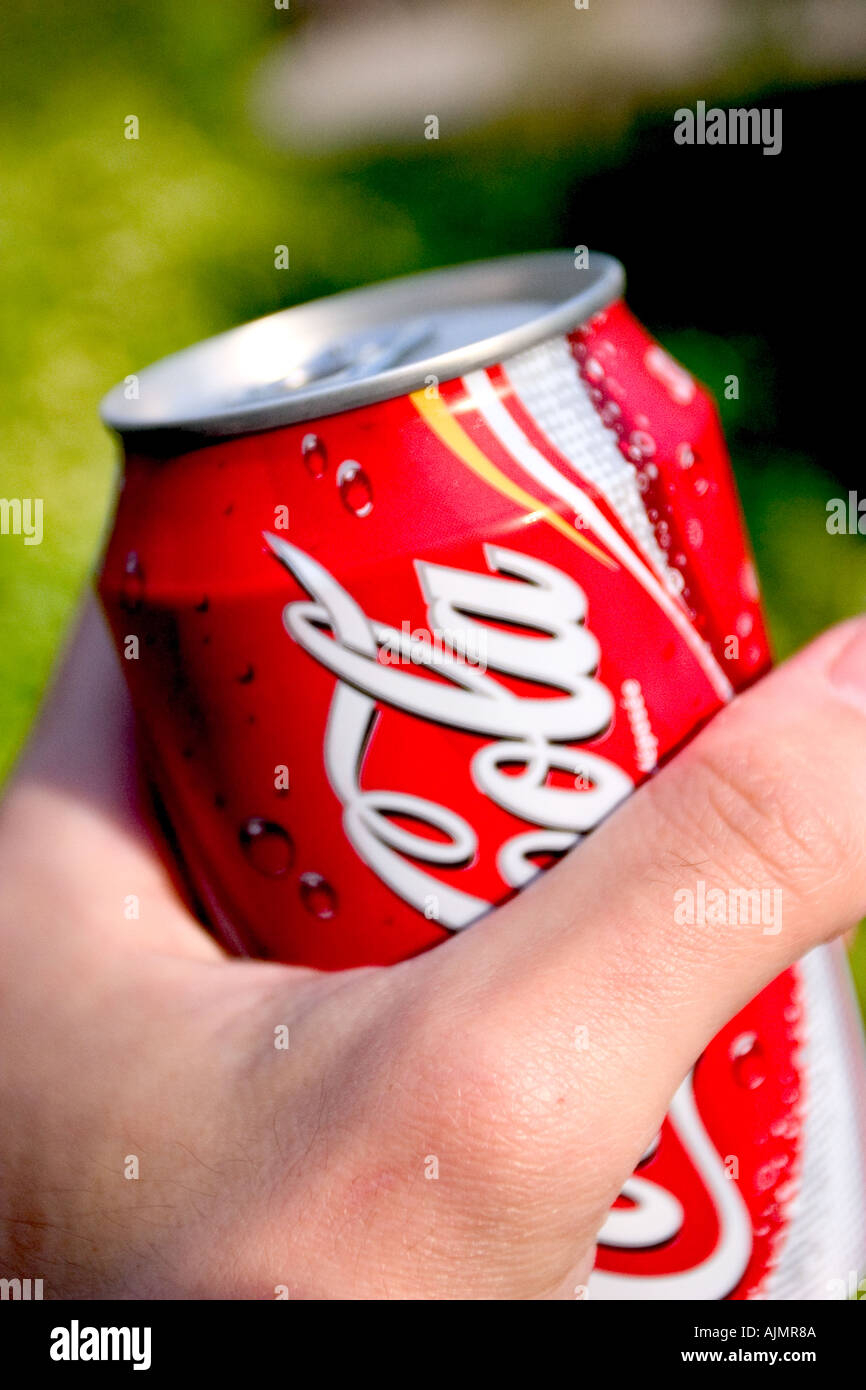 hand and fingers of man with can of coca cola in the blue sky Stock ...